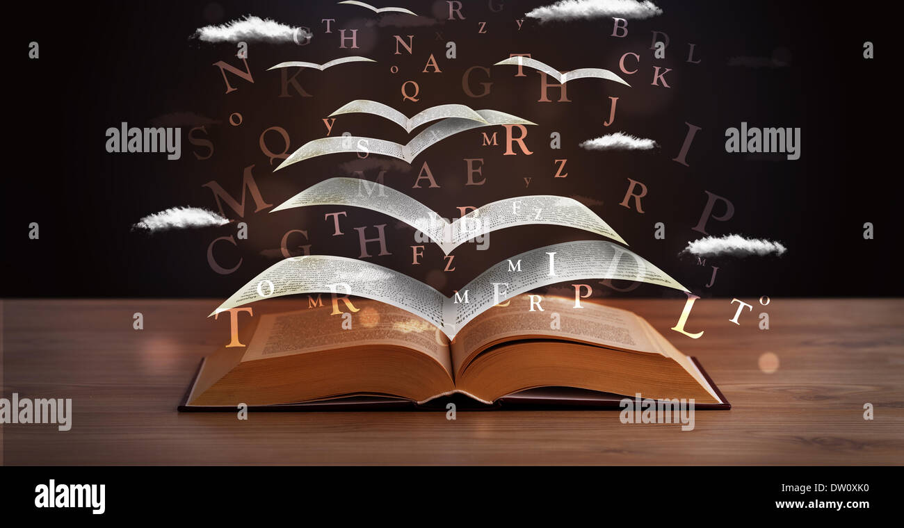 Pages and glowing letters flying out of a book Stock Photo - Alamy