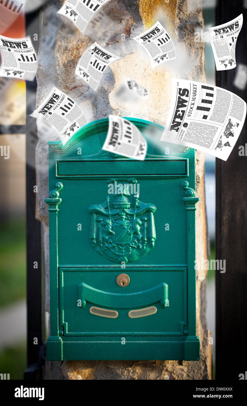 Post box with daily newspapers flying Stock Photo - Alamy