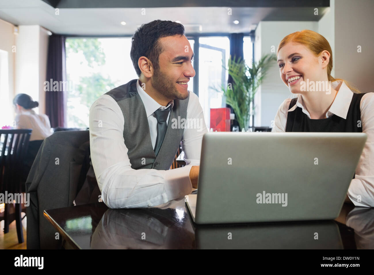 Happy business people working together Stock Photo - Alamy
