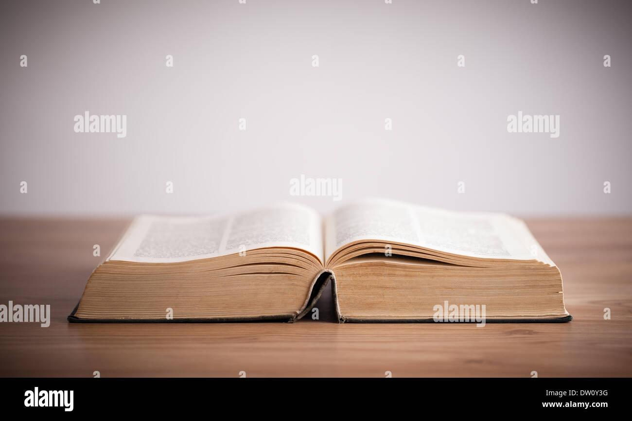 Open Book on wood background Stock Photo - Alamy