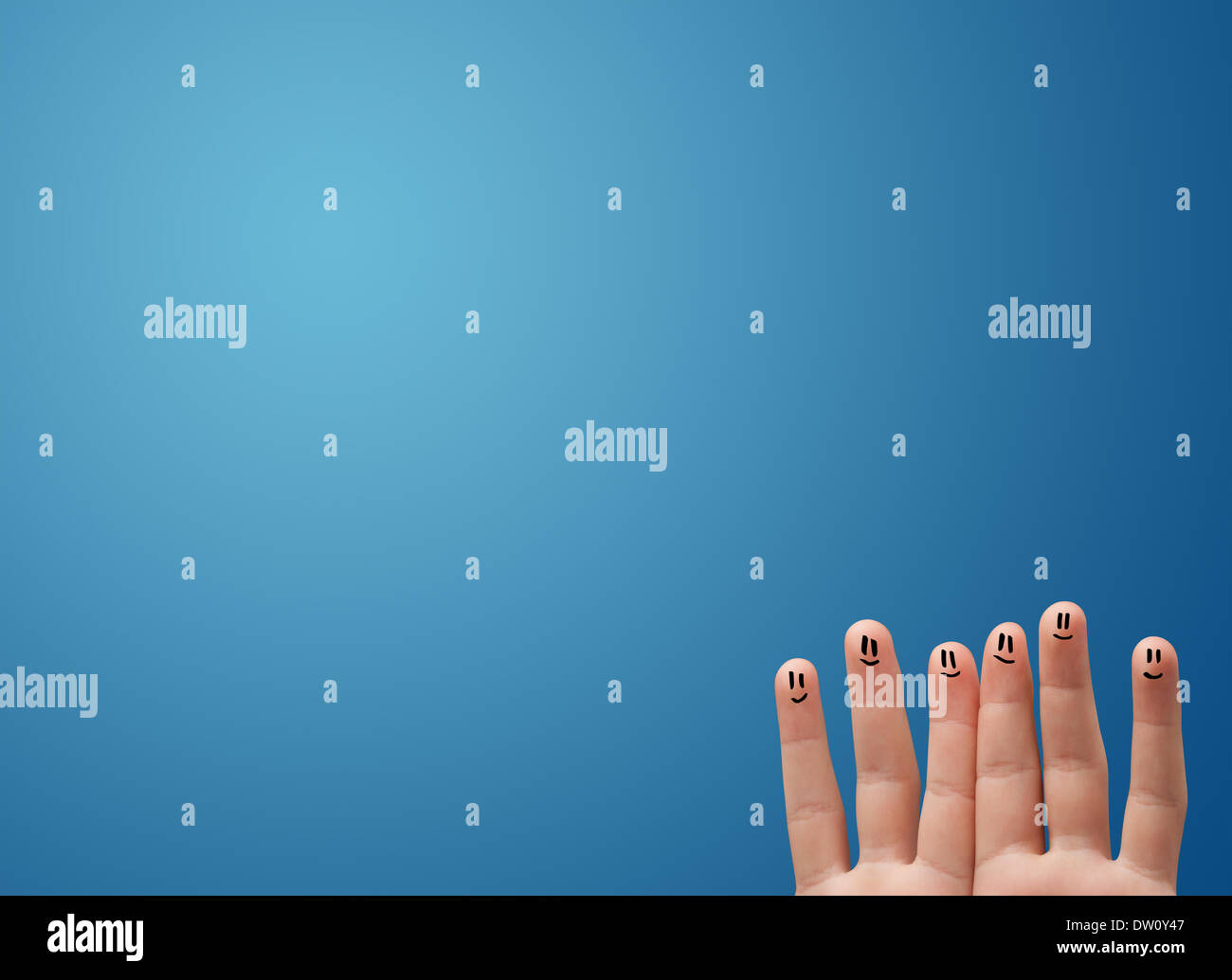 Happy smiley face fingers looking at empty blue background copy space ...