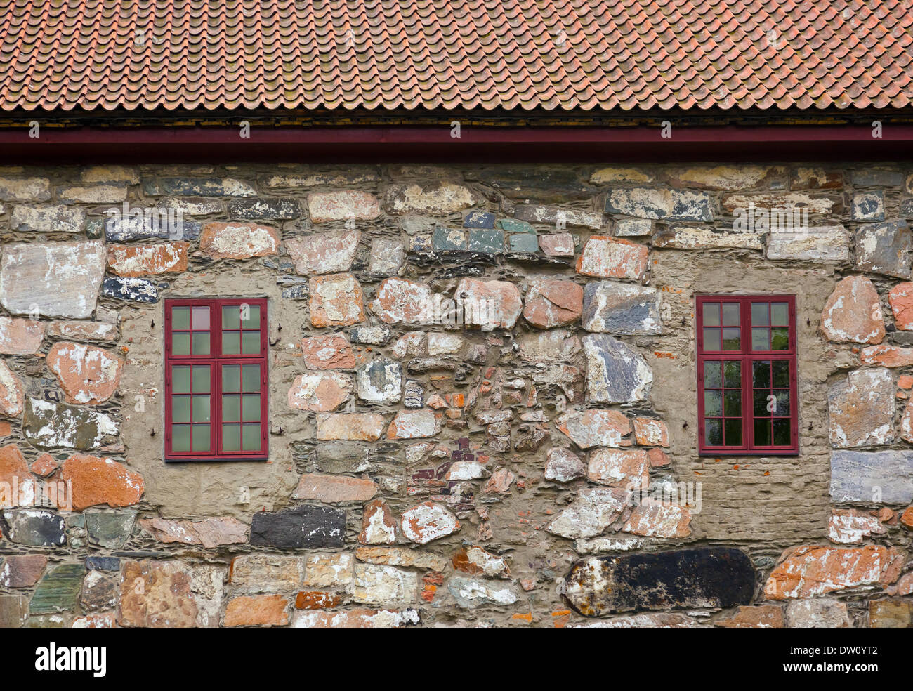 Windows in stone wall Stock Photo - Alamy