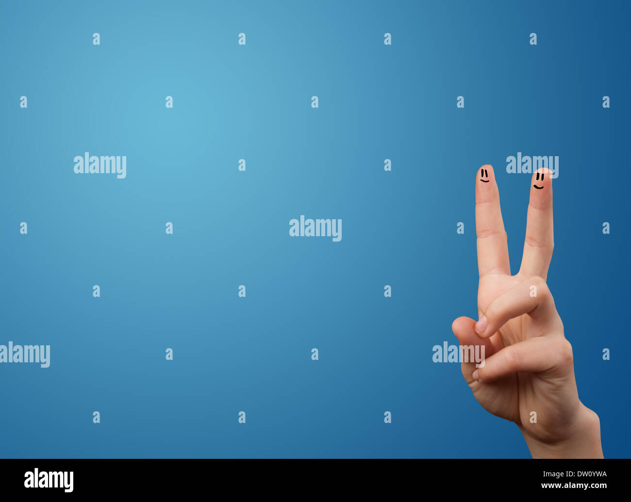 Happy smiley face fingers looking at empty blue background copy space ...