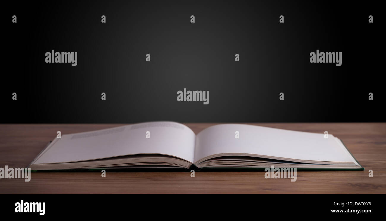 Open book on wooden deck Stock Photo - Alamy