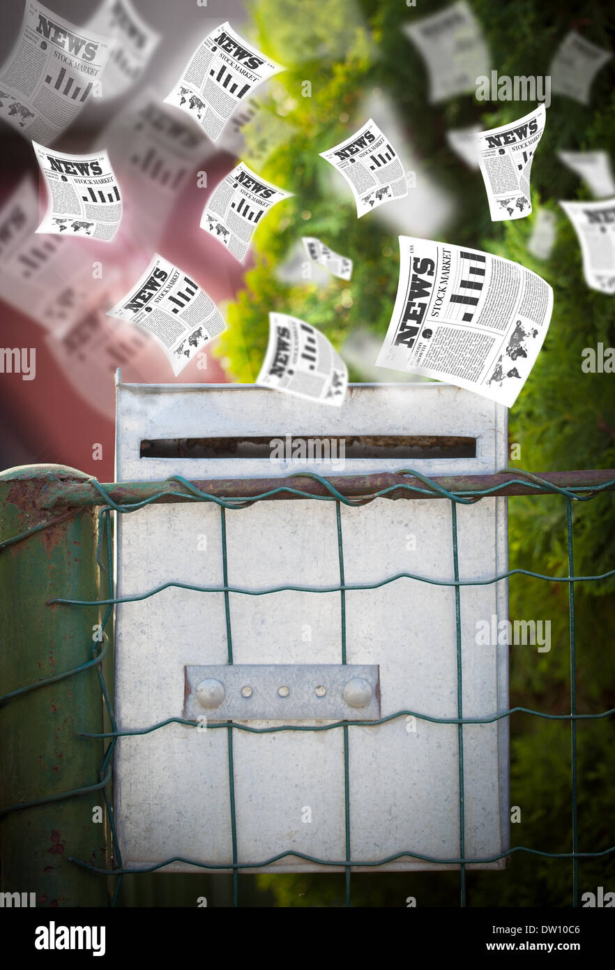Post box with daily newspapers flying Stock Photo - Alamy