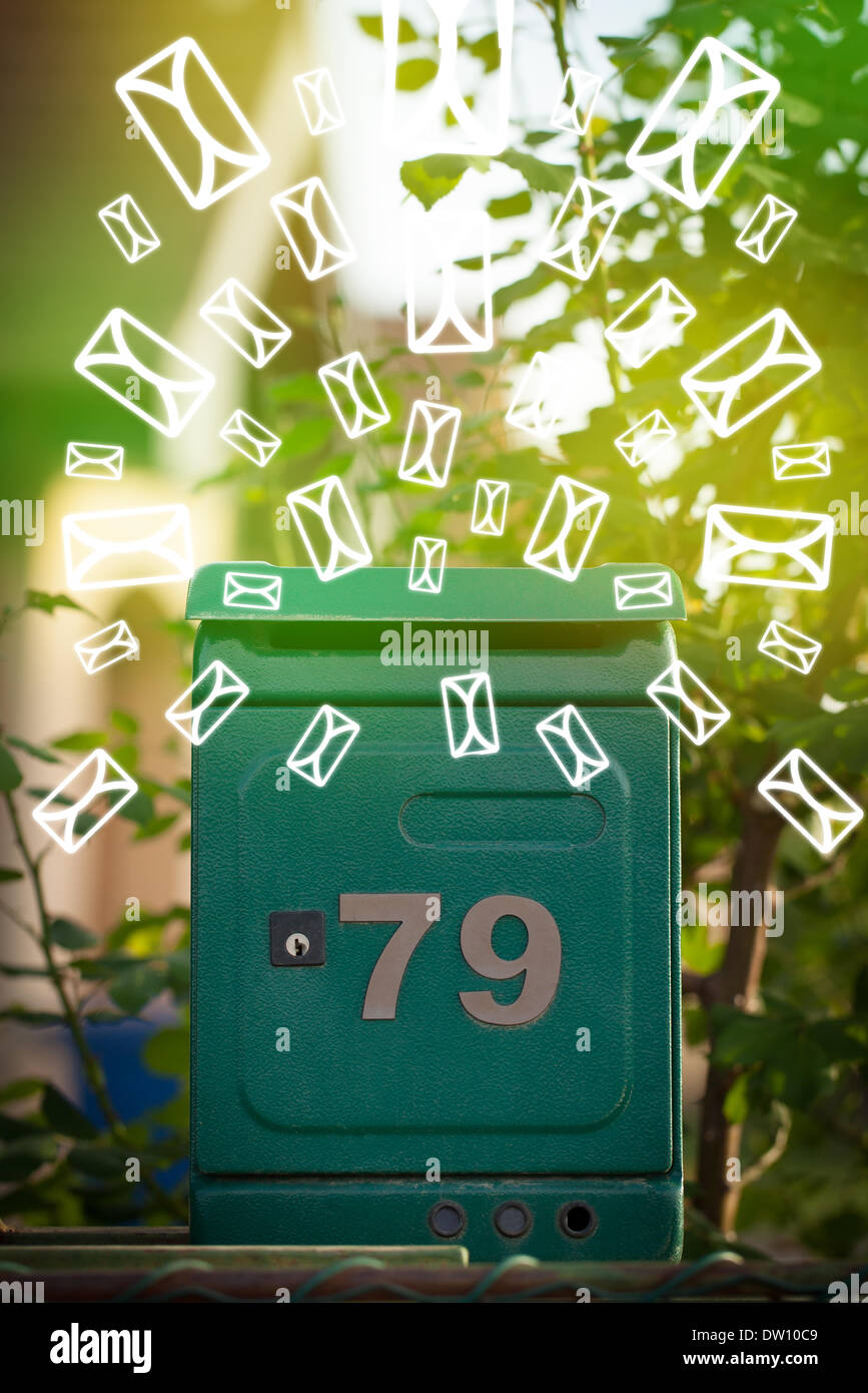 Mailbox with letter icons on glowing green background Stock Photo - Alamy