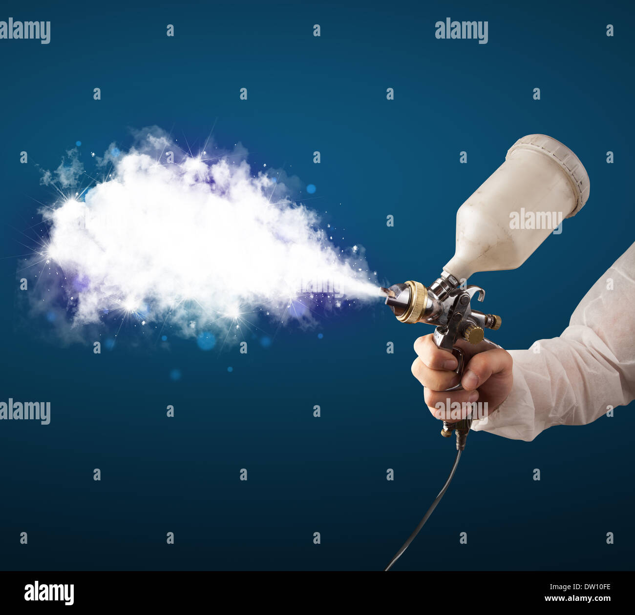 Painter with airbrush gun and white magical smoke Stock Photo - Alamy