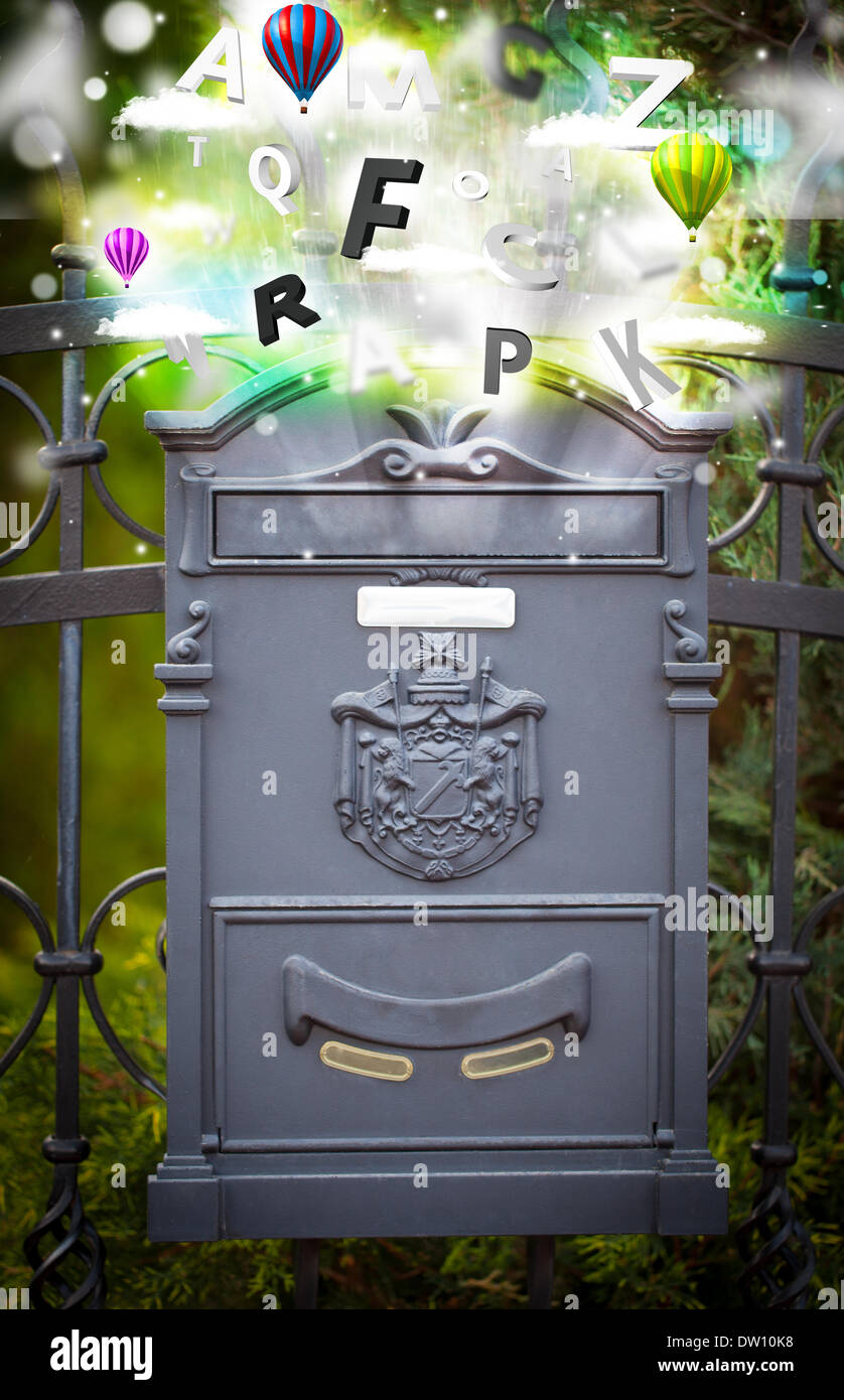 Post box with colorful letters Stock Photo - Alamy