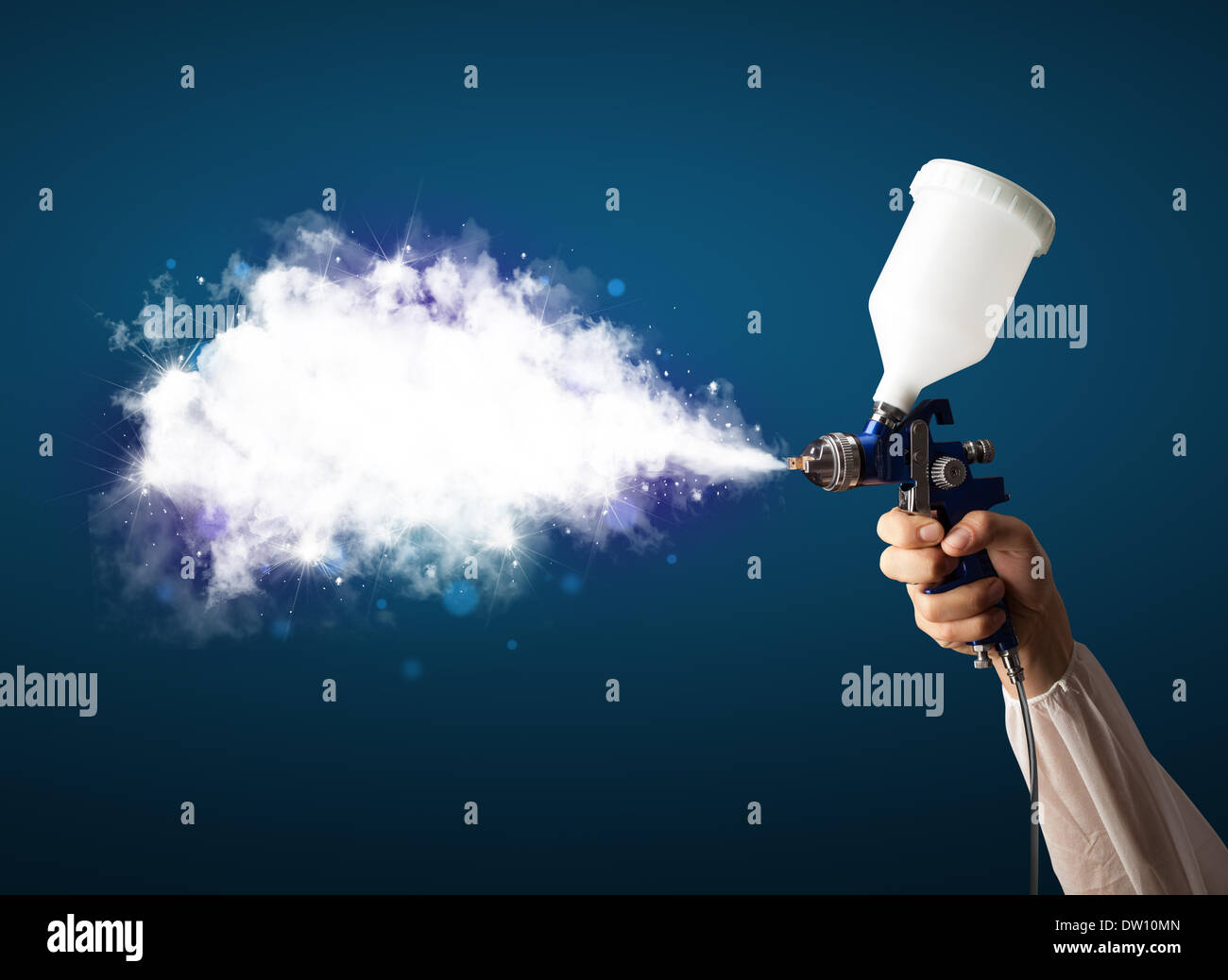 Painter with airbrush gun and white magical smoke Stock Photo - Alamy