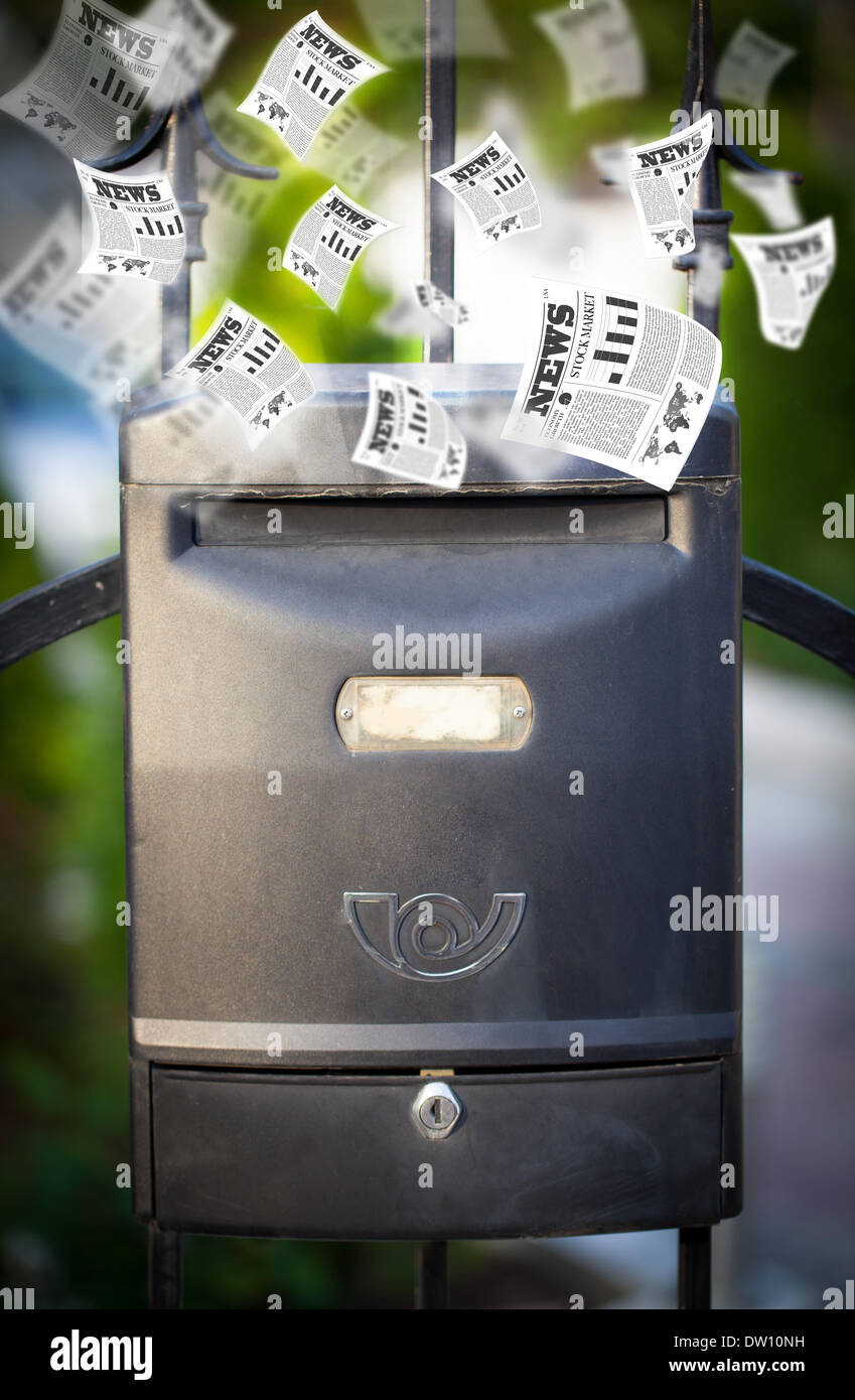 Post box with daily newspapers flying Stock Photo - Alamy