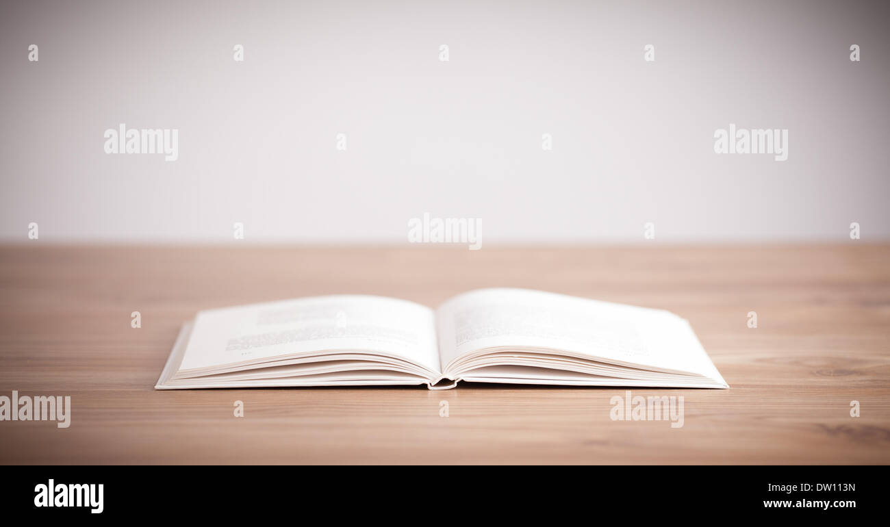Open Book on wood background Stock Photo - Alamy