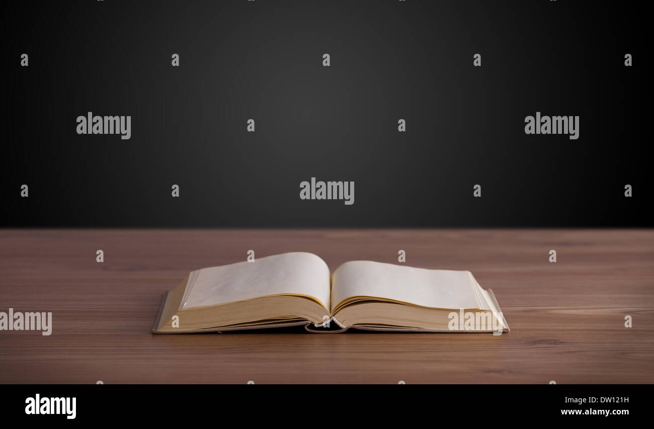 Open book on wooden deck Stock Photo - Alamy