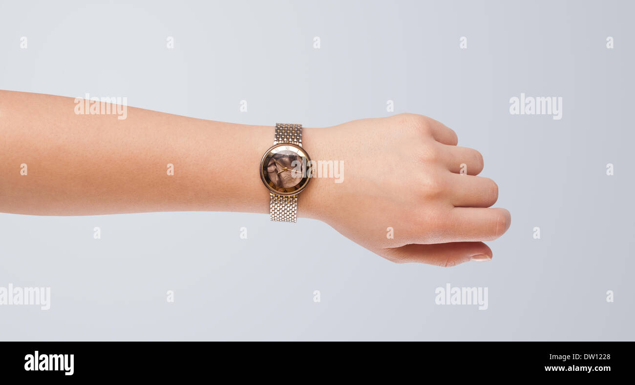 Hand with watch showing precise time Stock Photo - Alamy