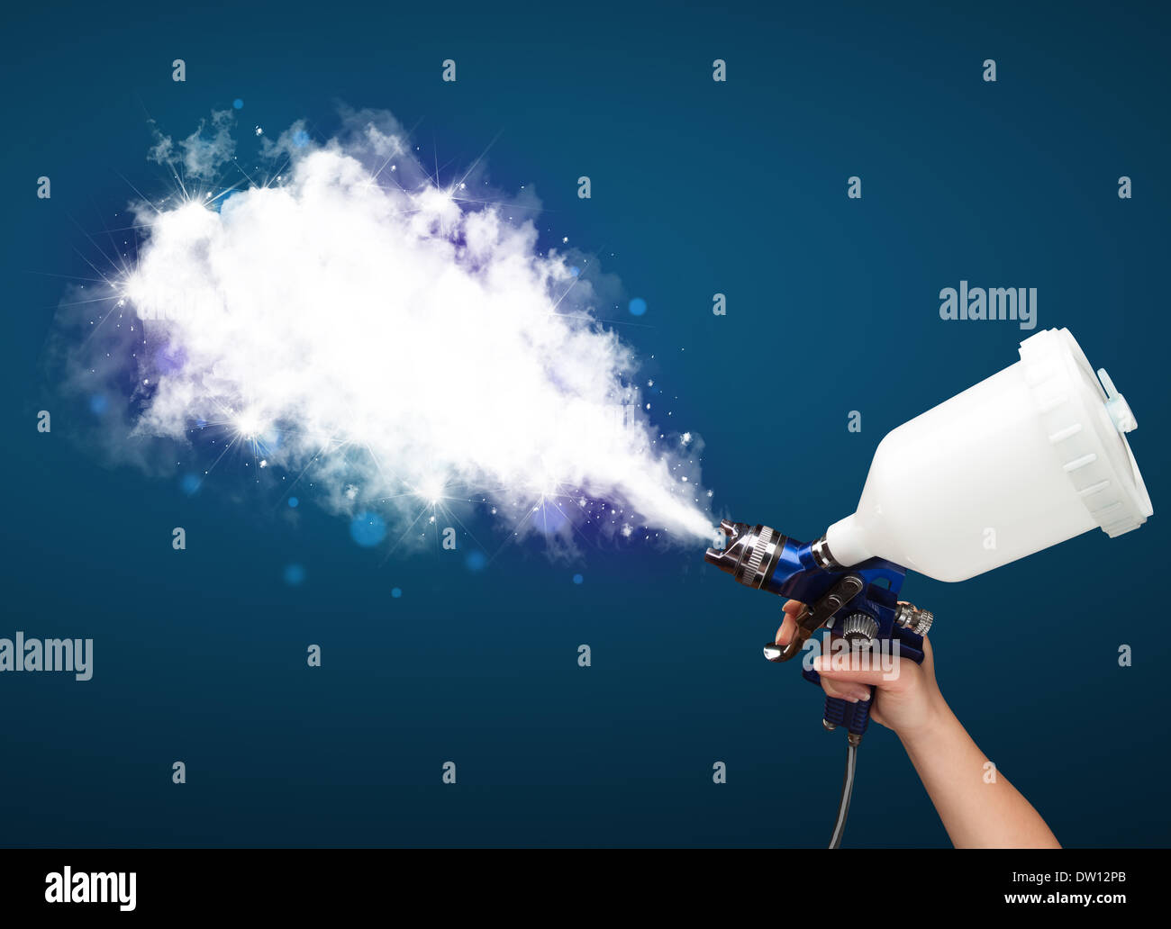 Painter with airbrush gun and white magical smoke Stock Photo - Alamy
