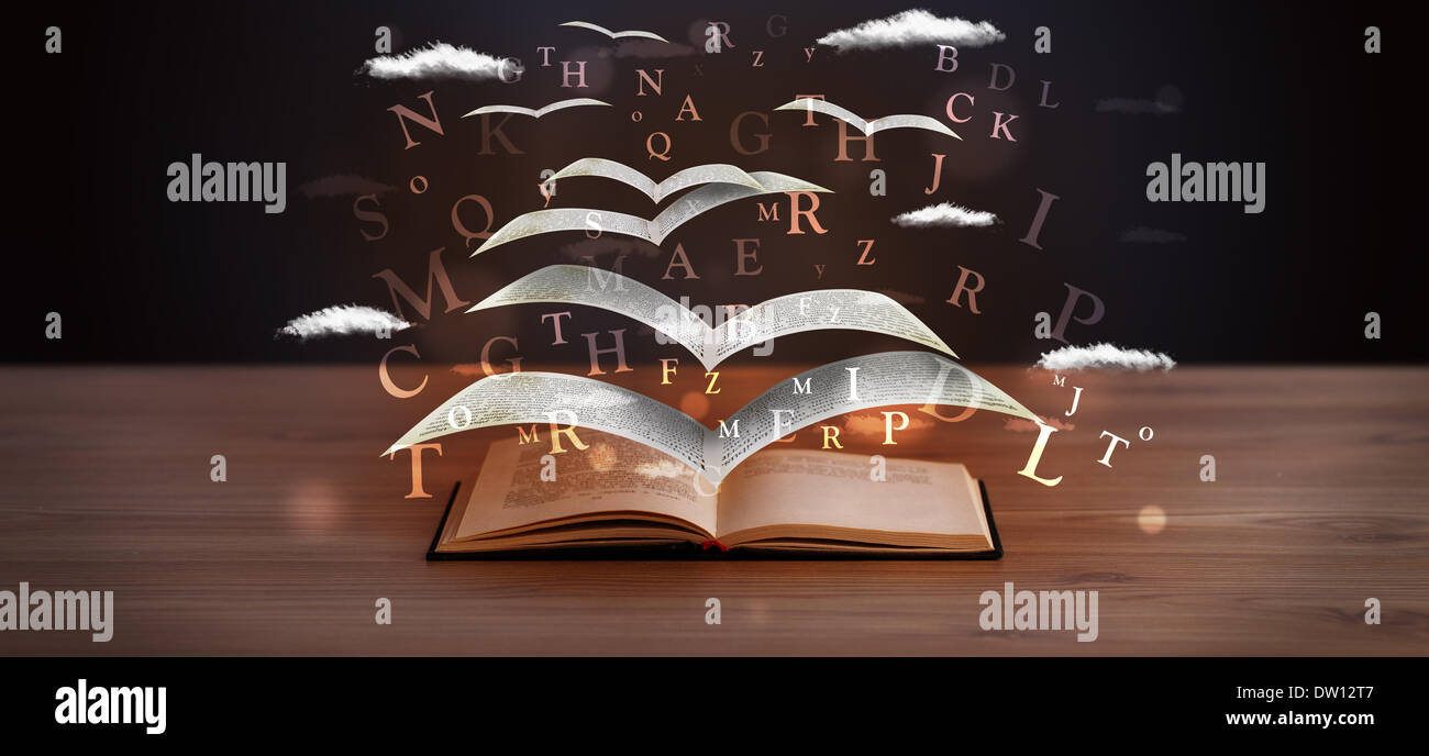 Pages and glowing letters flying out of a book Stock Photo - Alamy