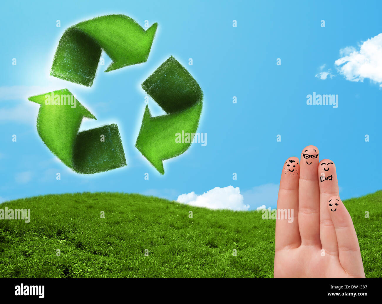 Happy smiley fingers looking at green leaf recycle sign Stock Photo - Alamy