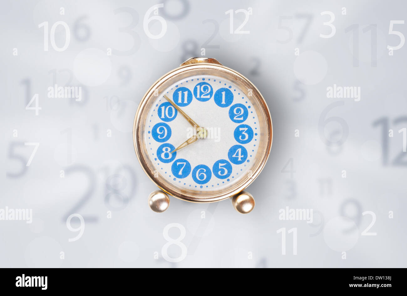 Modern clock with numbers comming out Stock Photo - Alamy