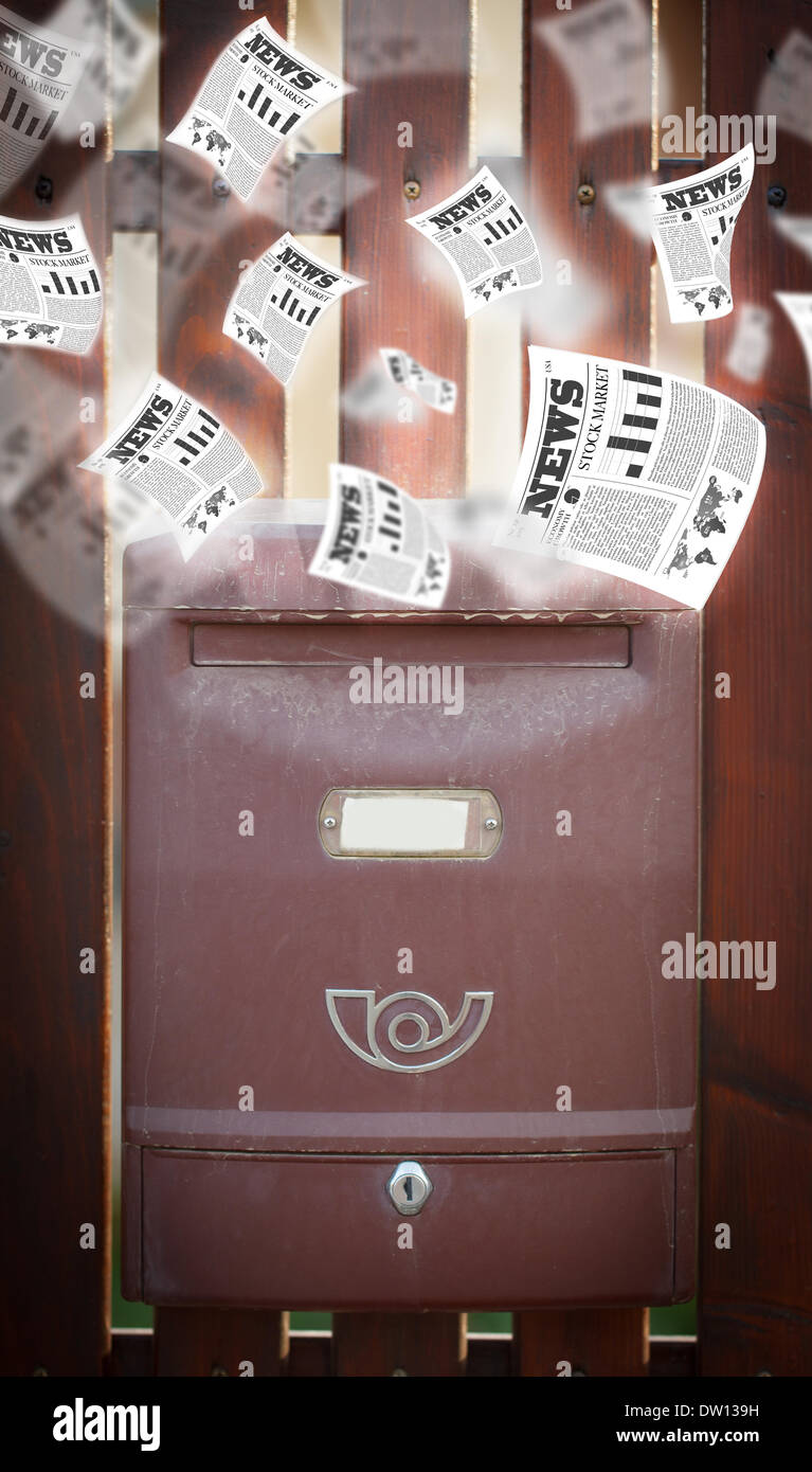 Post box with daily newspapers flying Stock Photo - Alamy