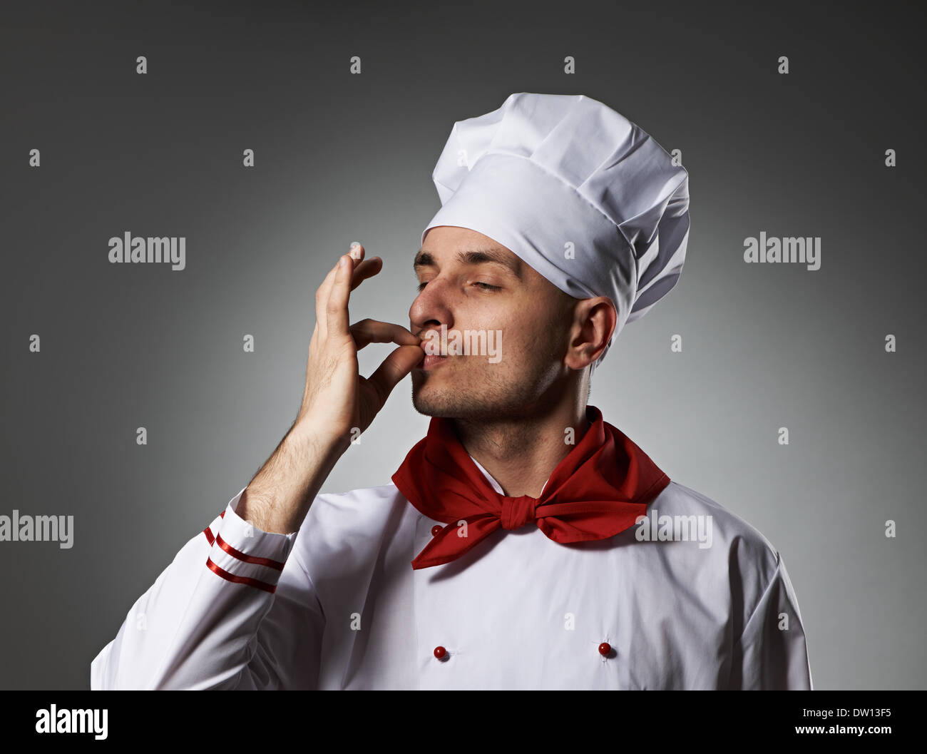 Male chef kissing fingers Stock Photo - Alamy