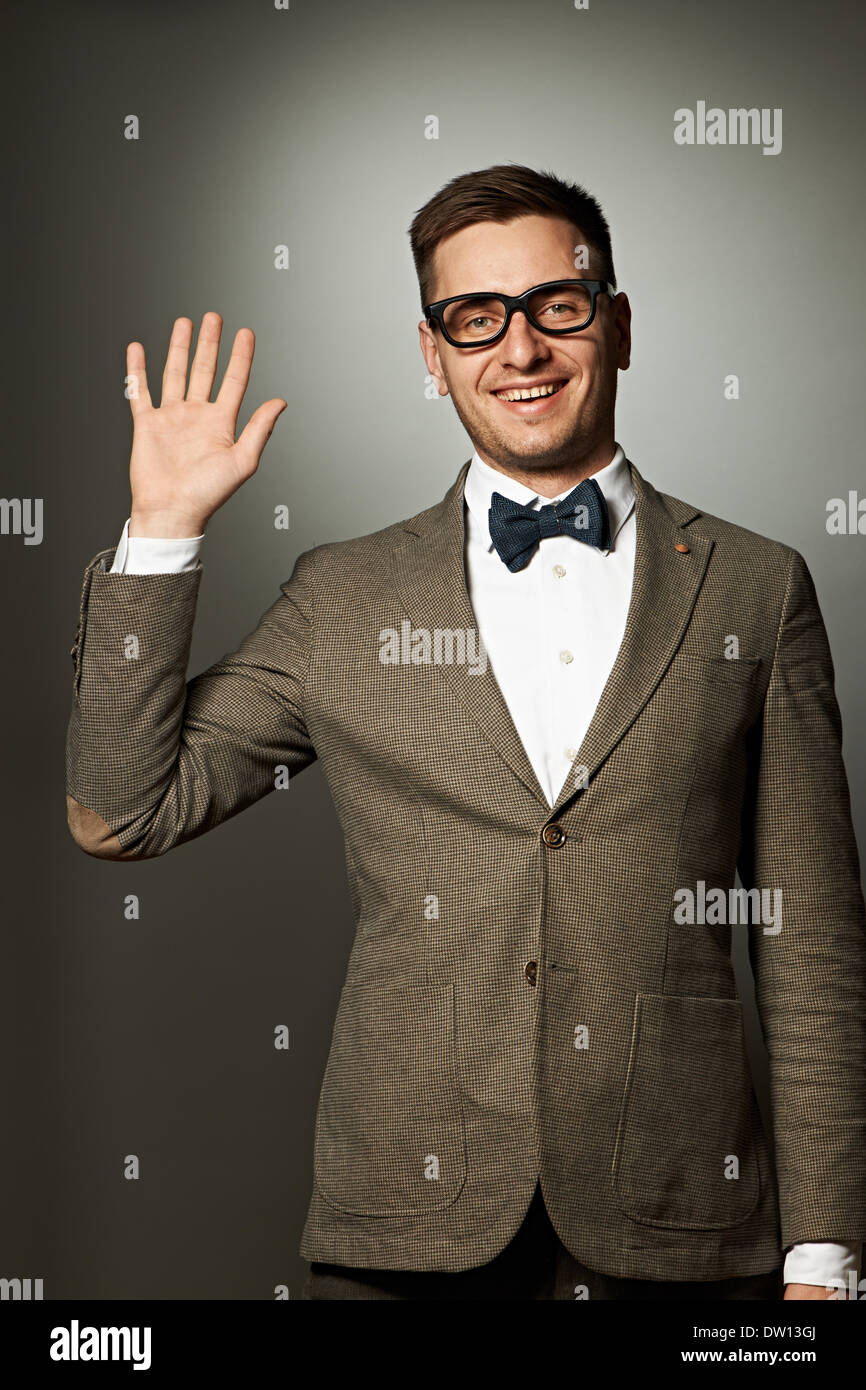 Nerd in eyeglasses and bow tie says Hello Stock Photo - Alamy