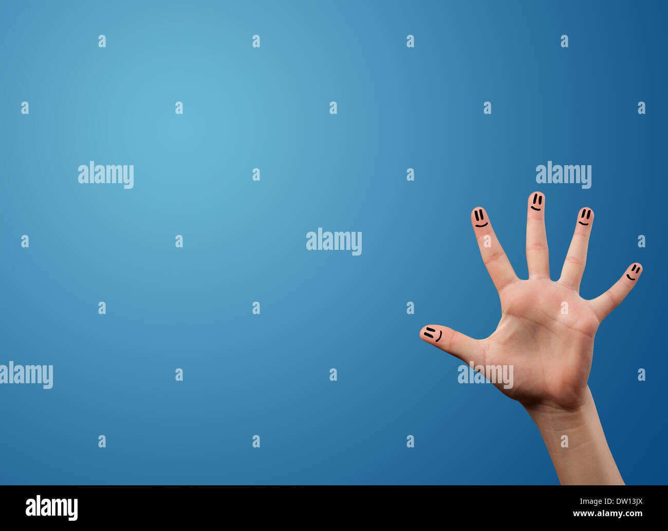 Happy smiley face fingers looking at empty blue background copy space ...