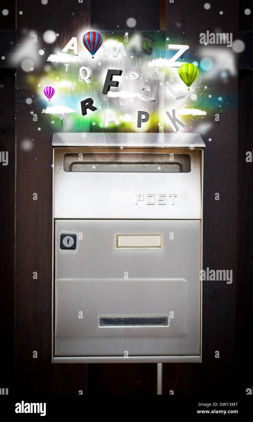 Post box with colorful letters Stock Photo - Alamy