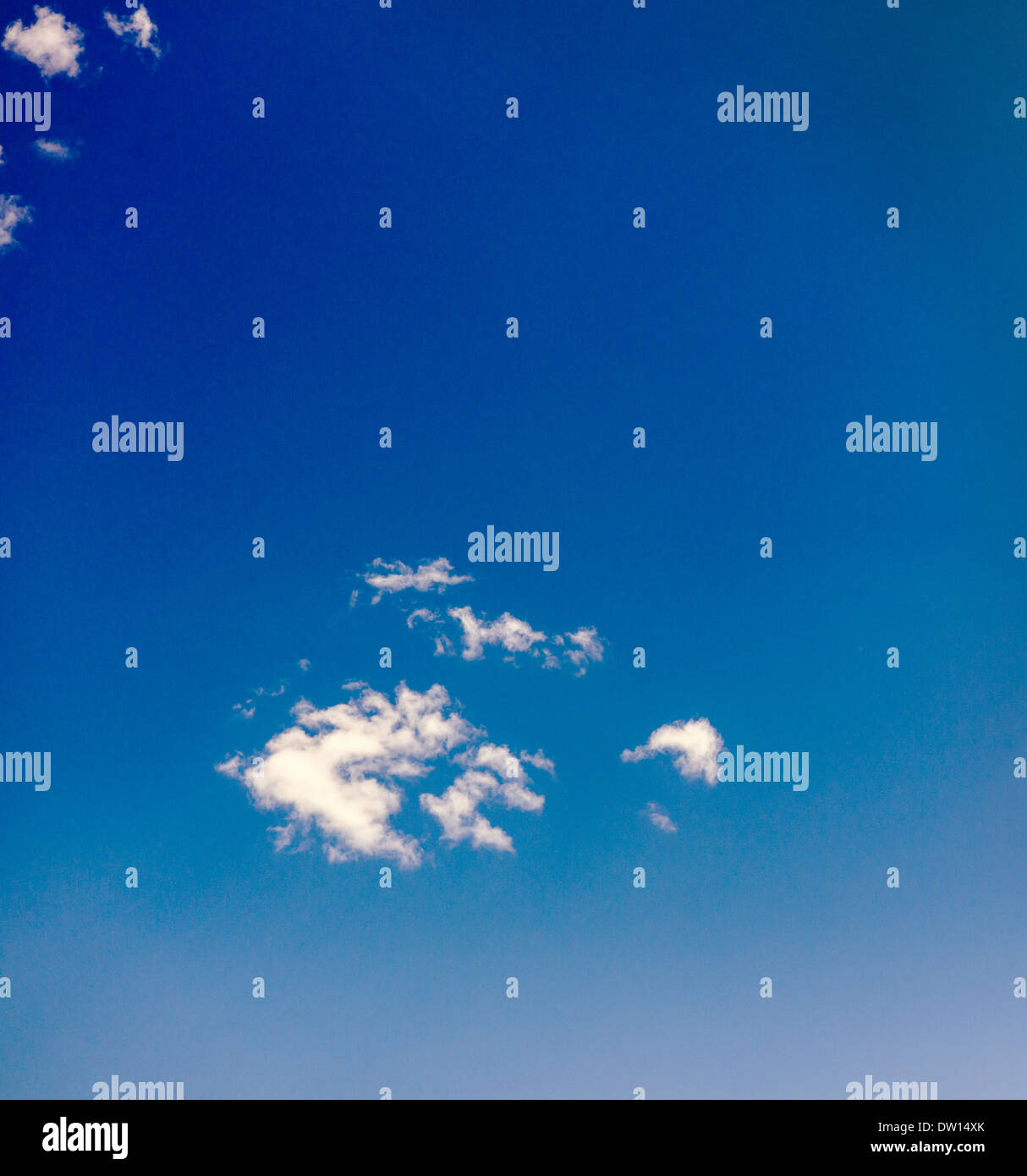 Wispy white clouds float in an azure blue Colorado sky Stock Photo - Alamy