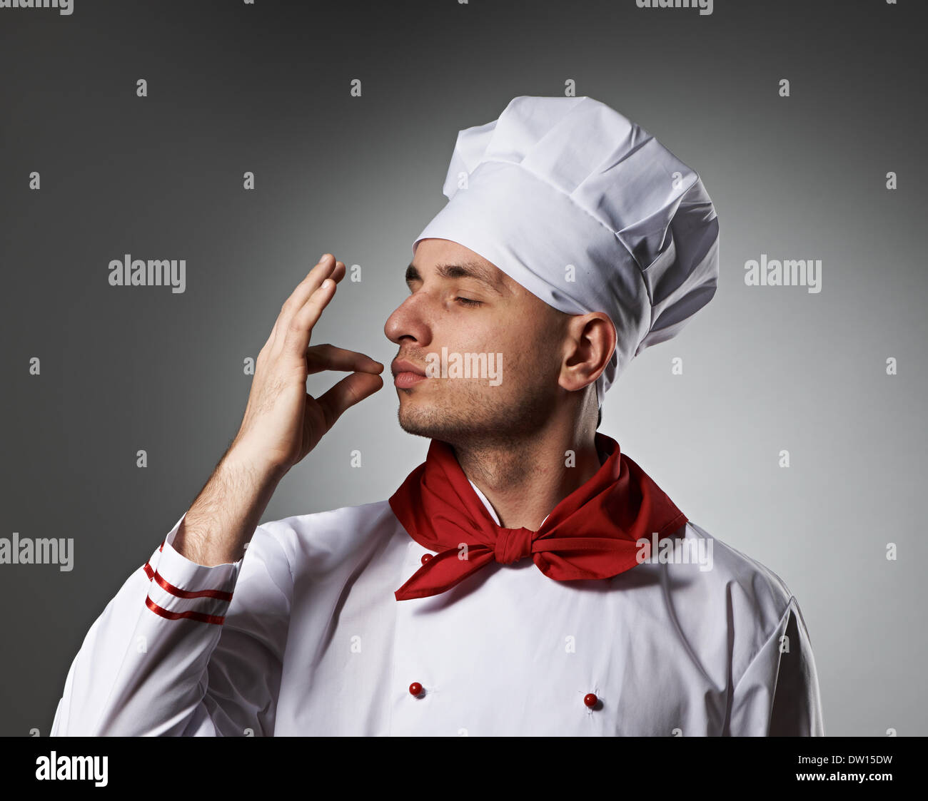 Male chef kissing fingers Stock Photo - Alamy