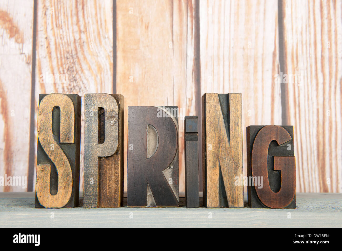 spring written with vintage used print letters Stock Photo - Alamy