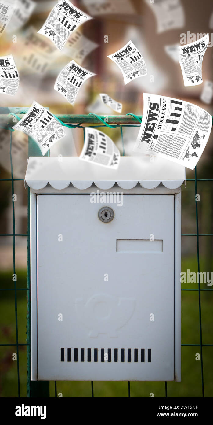 Post box with daily newspapers flying Stock Photo - Alamy