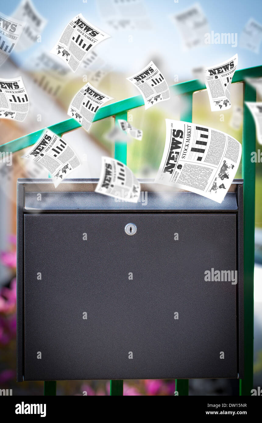 Post box with daily newspapers flying Stock Photo - Alamy