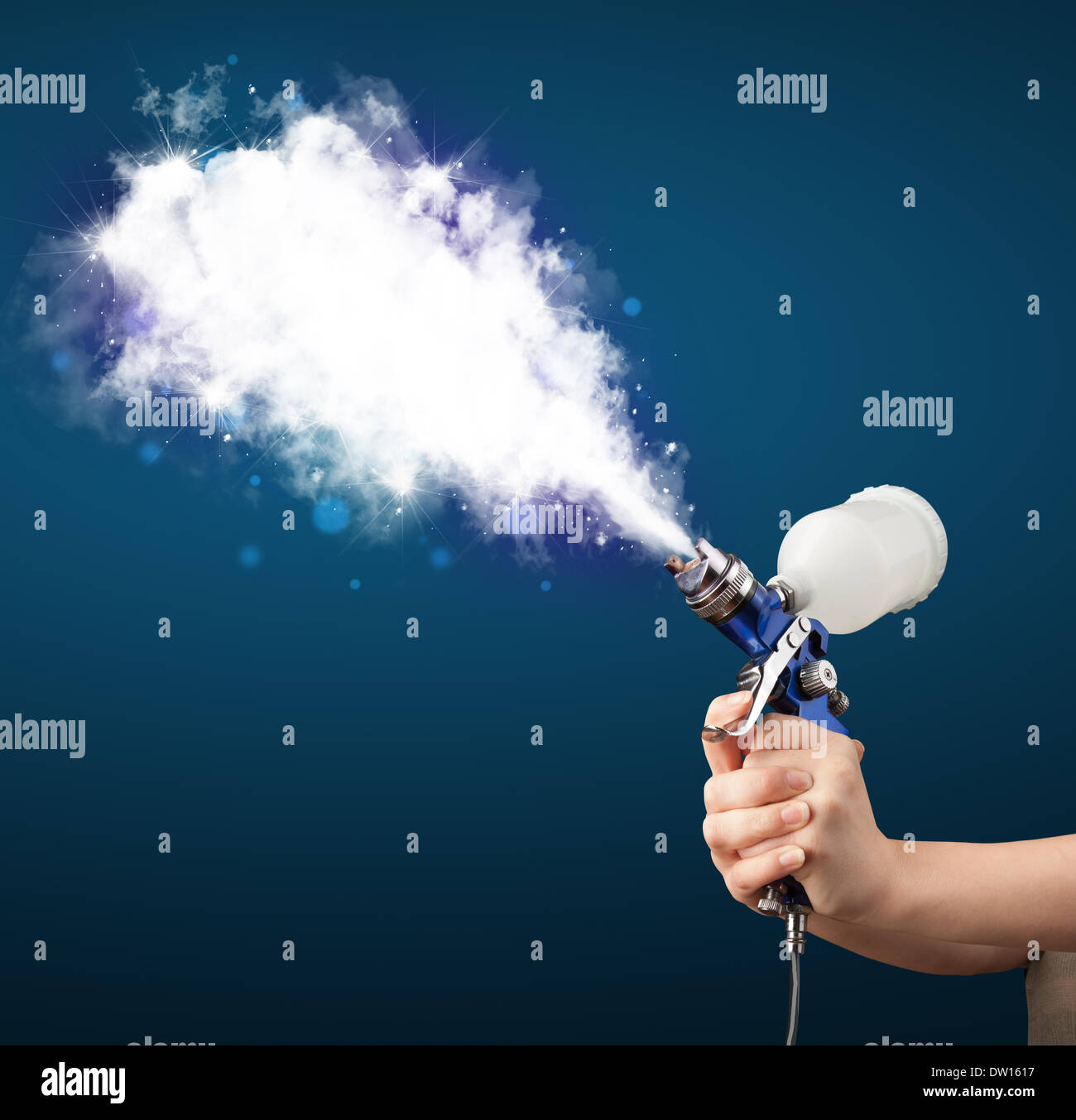 Painter with airbrush gun and white magical smoke Stock Photo - Alamy