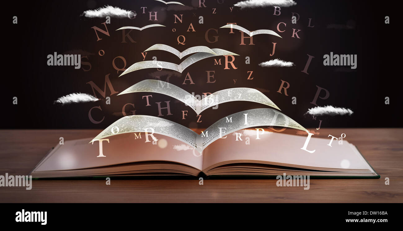 Pages and glowing letters flying out of a book Stock Photo - Alamy