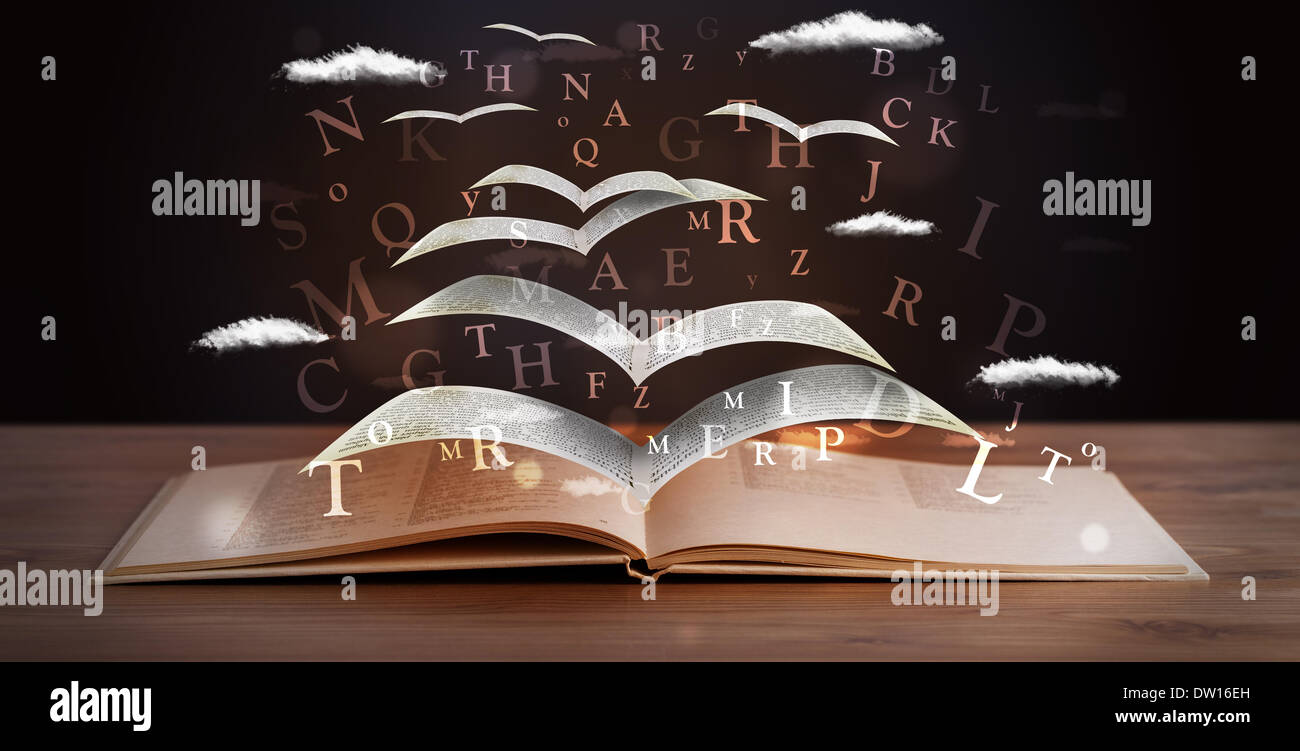 Pages and glowing letters flying out of a book Stock Photo - Alamy