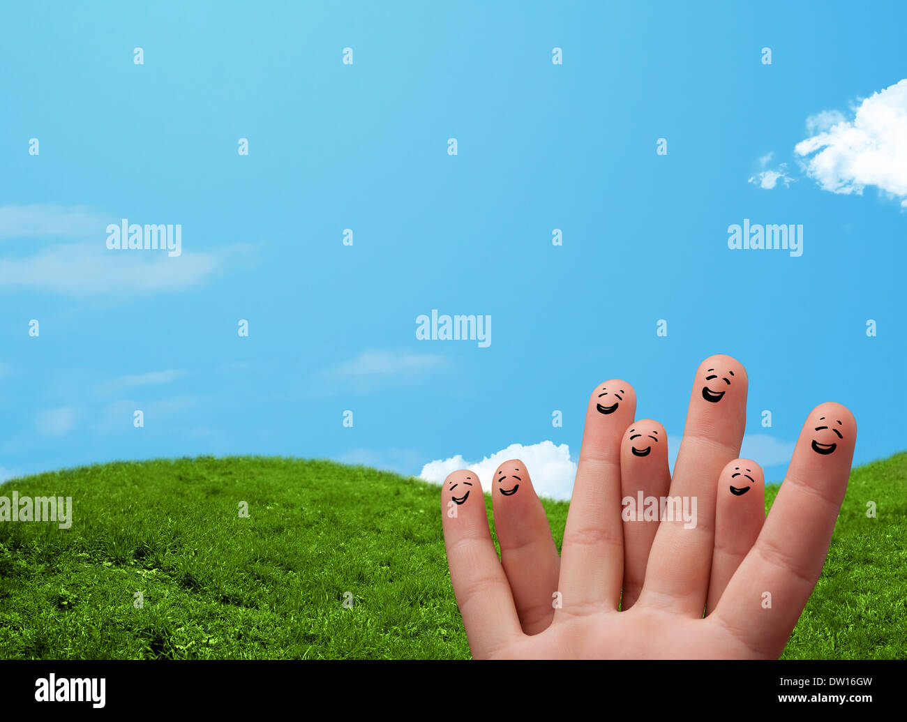 Cheerful finger smileys with landscape scenery at the background Stock ...
