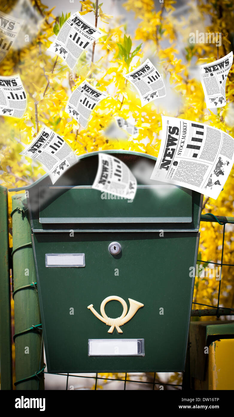 Post box with daily newspapers flying Stock Photo - Alamy