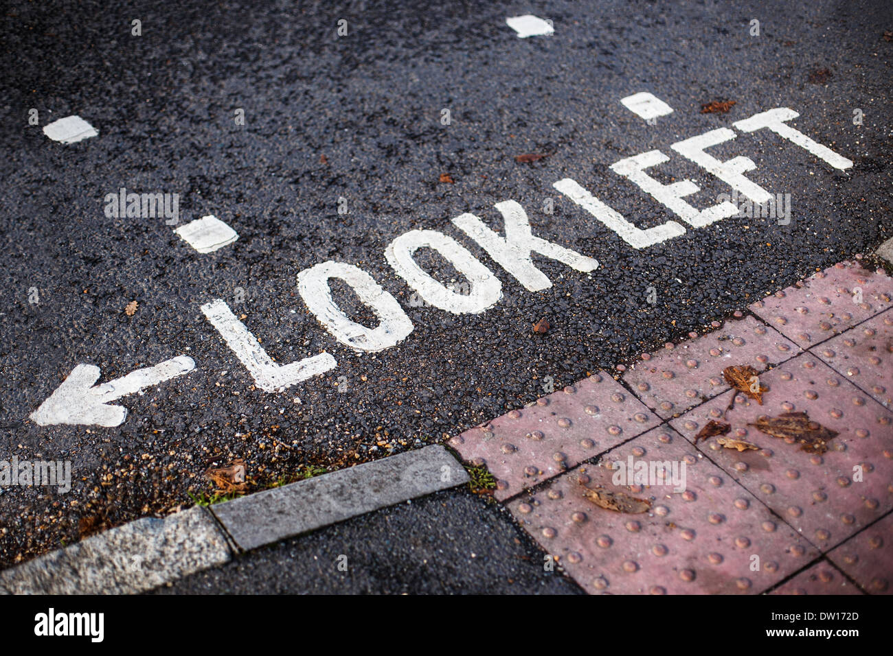 Pedestrian crossing, with Look Left warning sign Stock Photo - Alamy