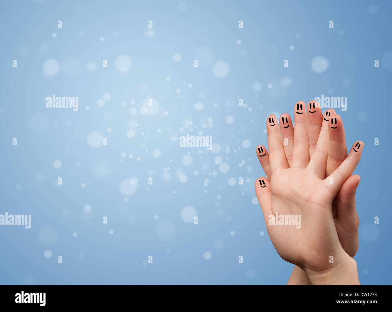 Happy finger smileys with empty blue bokeh background Stock Photo - Alamy