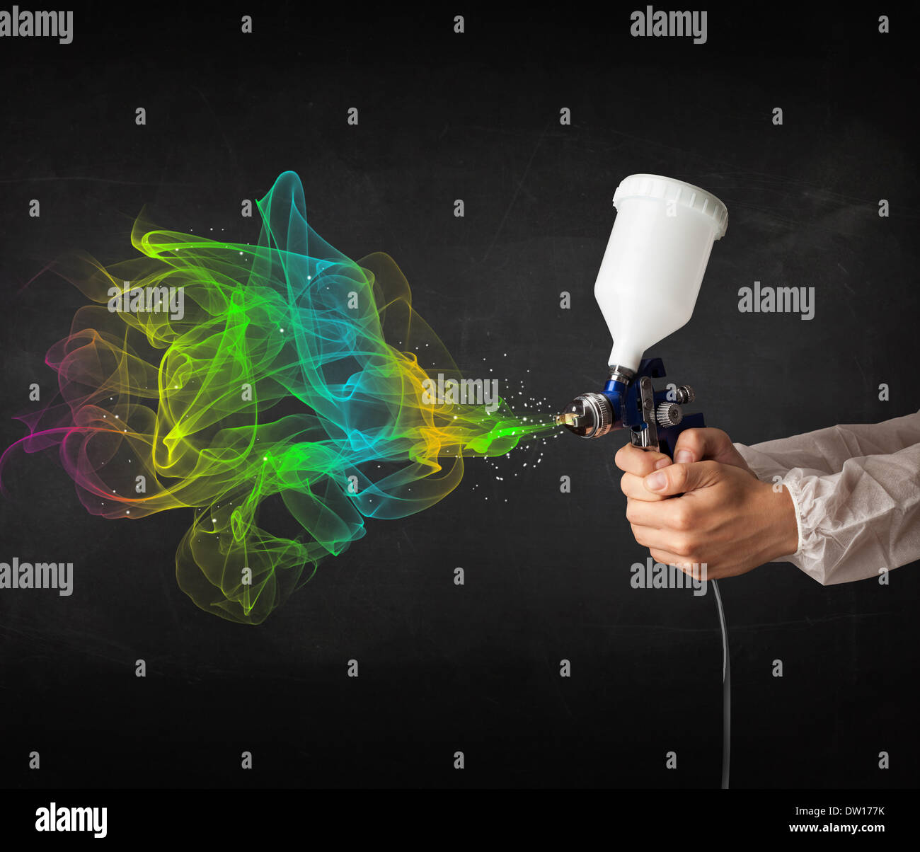Painter working with airbrush and paints colorful paint Stock Photo - Alamy
