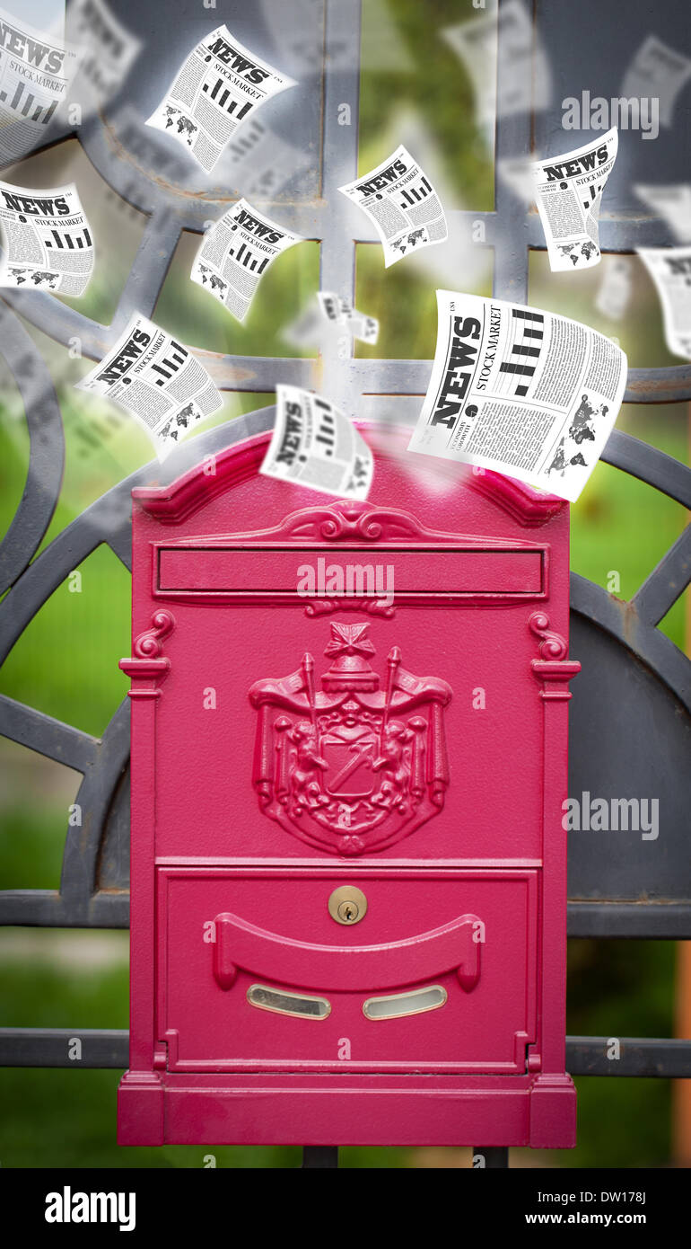 Post box with daily newspapers flying Stock Photo - Alamy