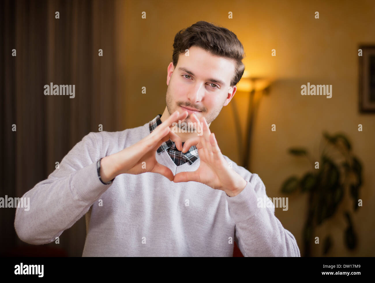 Hands making home sign hi-res stock photography and images - Alamy