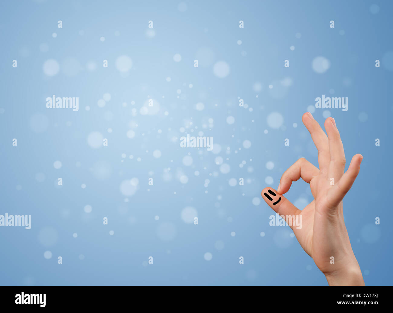 Happy finger smileys with empty blue bokeh background Stock Photo - Alamy