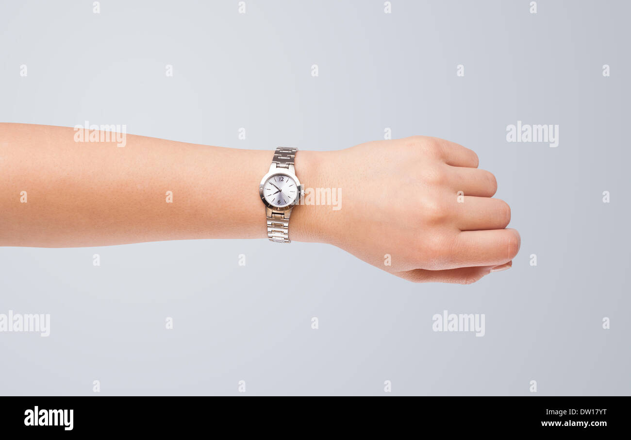 Hand with watch showing precise time Stock Photo - Alamy