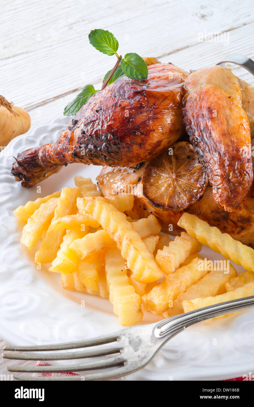 chickens with French fries Stock Photo - Alamy
