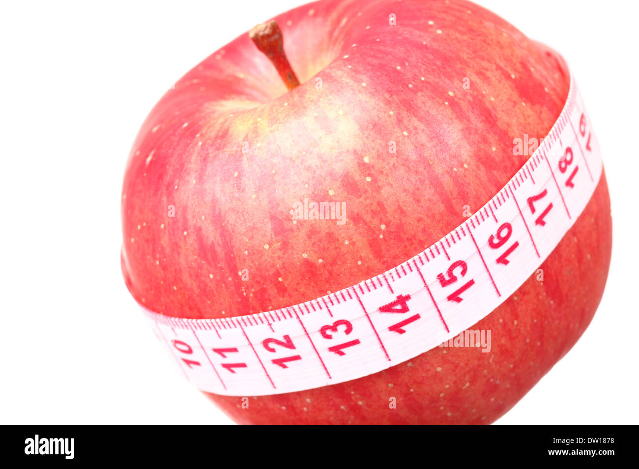 Closeup view of a red apple with tape measure Stock Photo - Alamy