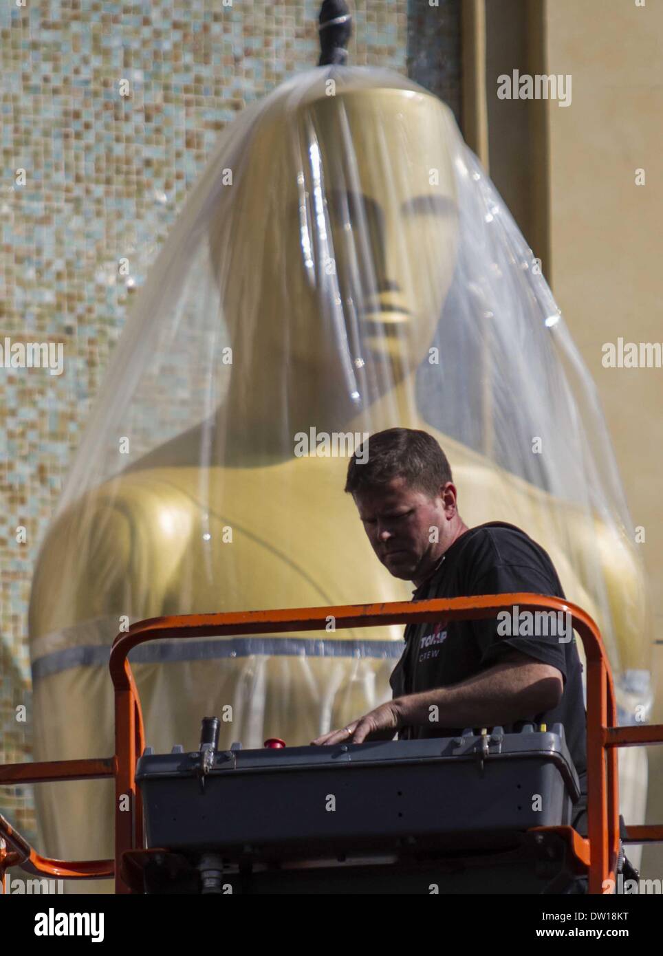 Los Angeles, California, USA. 25th Feb, 2014. A staff works on the ...
