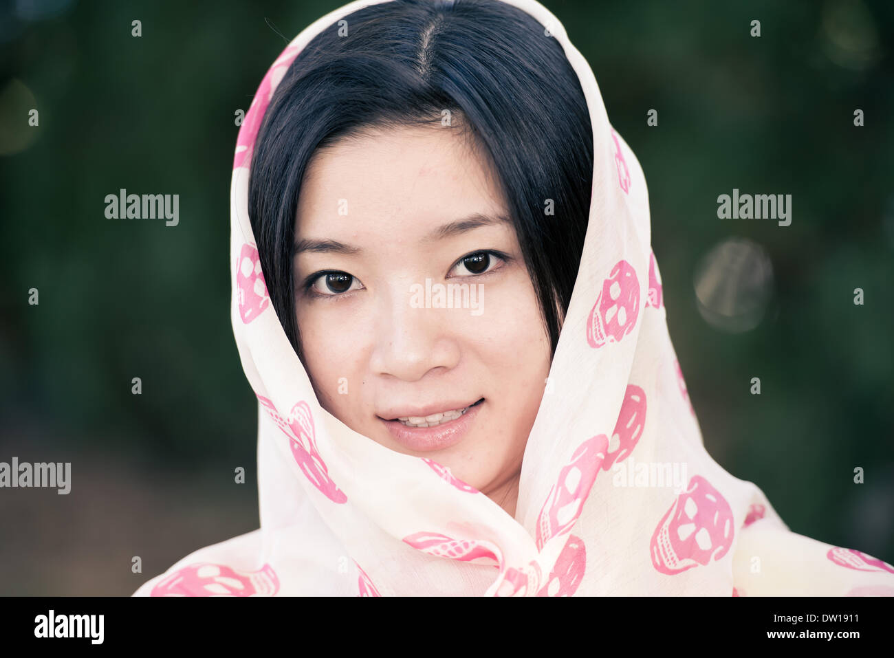 Girl with scarf covering head Stock Photo - Alamy