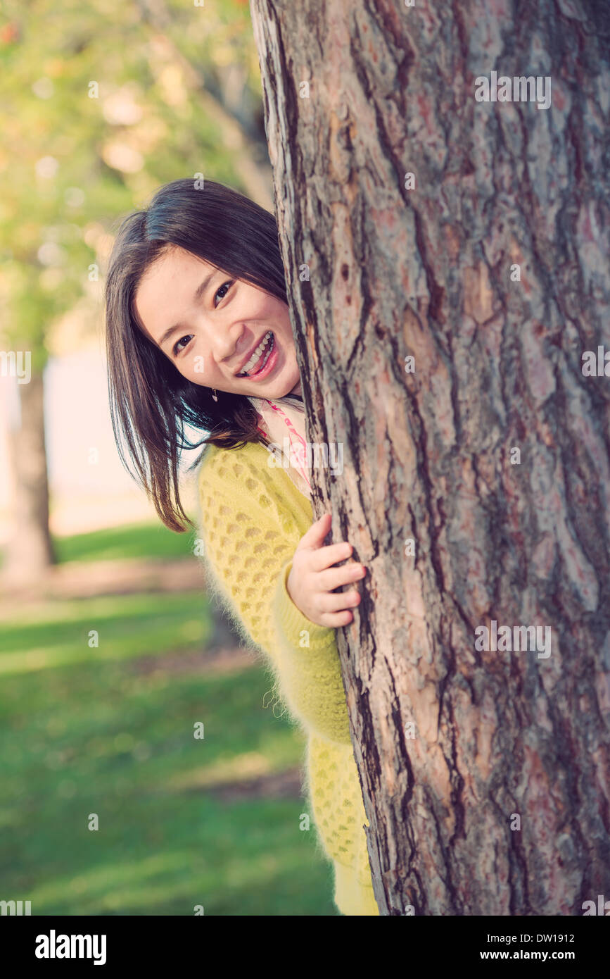 Portrait girl hiding behind leaf hi-res stock photography and images ...