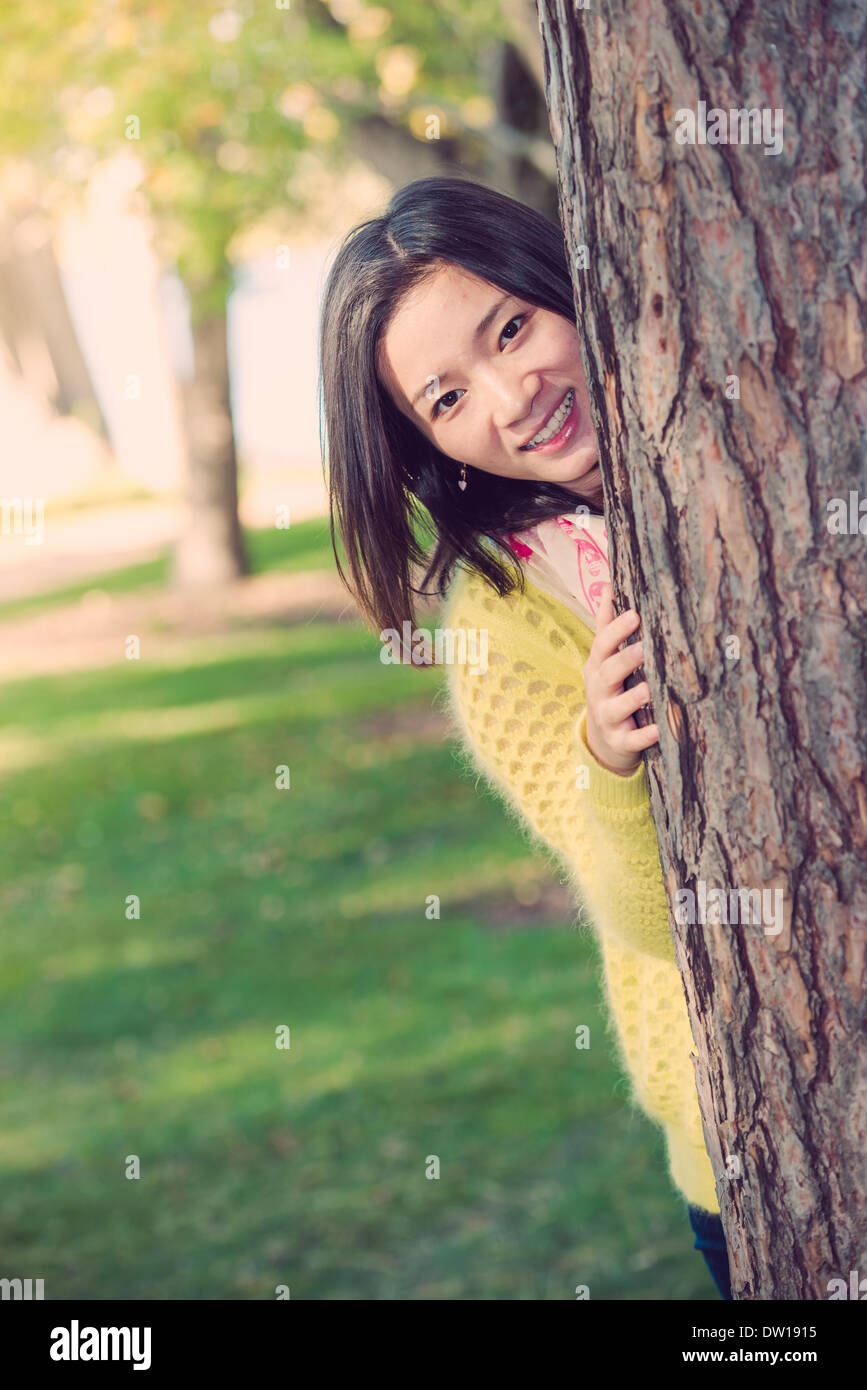 Portrait girl hiding behind leaf hi-res stock photography and images ...