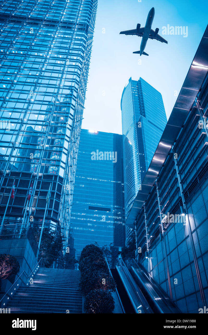 modern building with airplane at dusk Stock Photo - Alamy